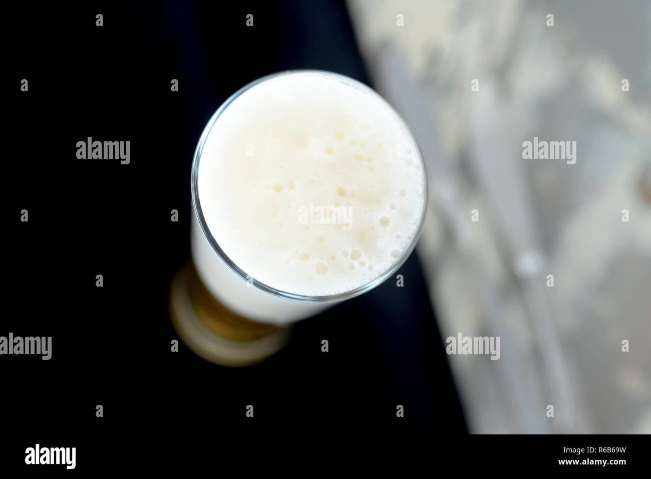Glass of beer view from the top on black background Stock Photo - Alamy
