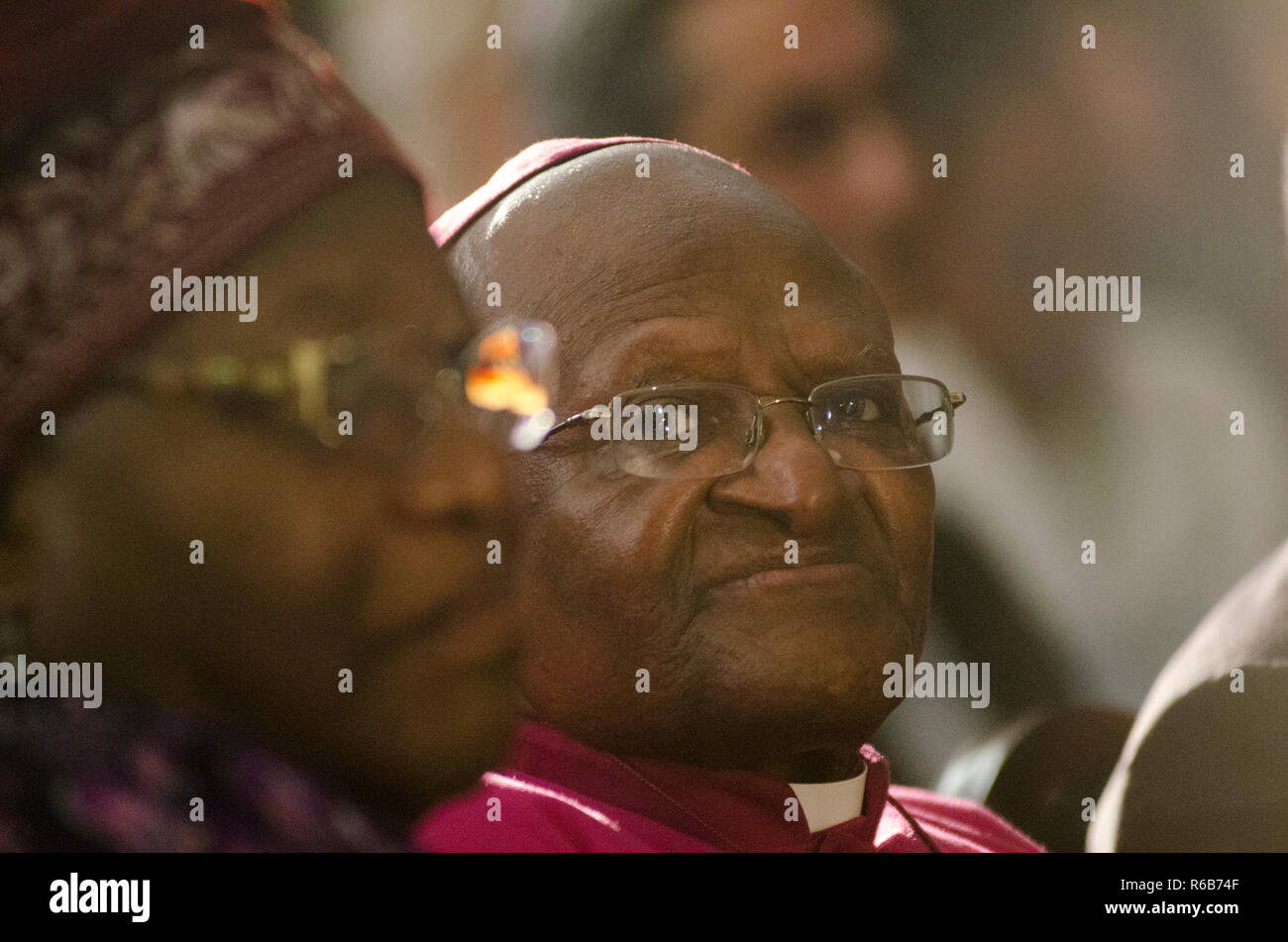 Archbishop Desmond Tutu is seated at a memory celebration for former ...