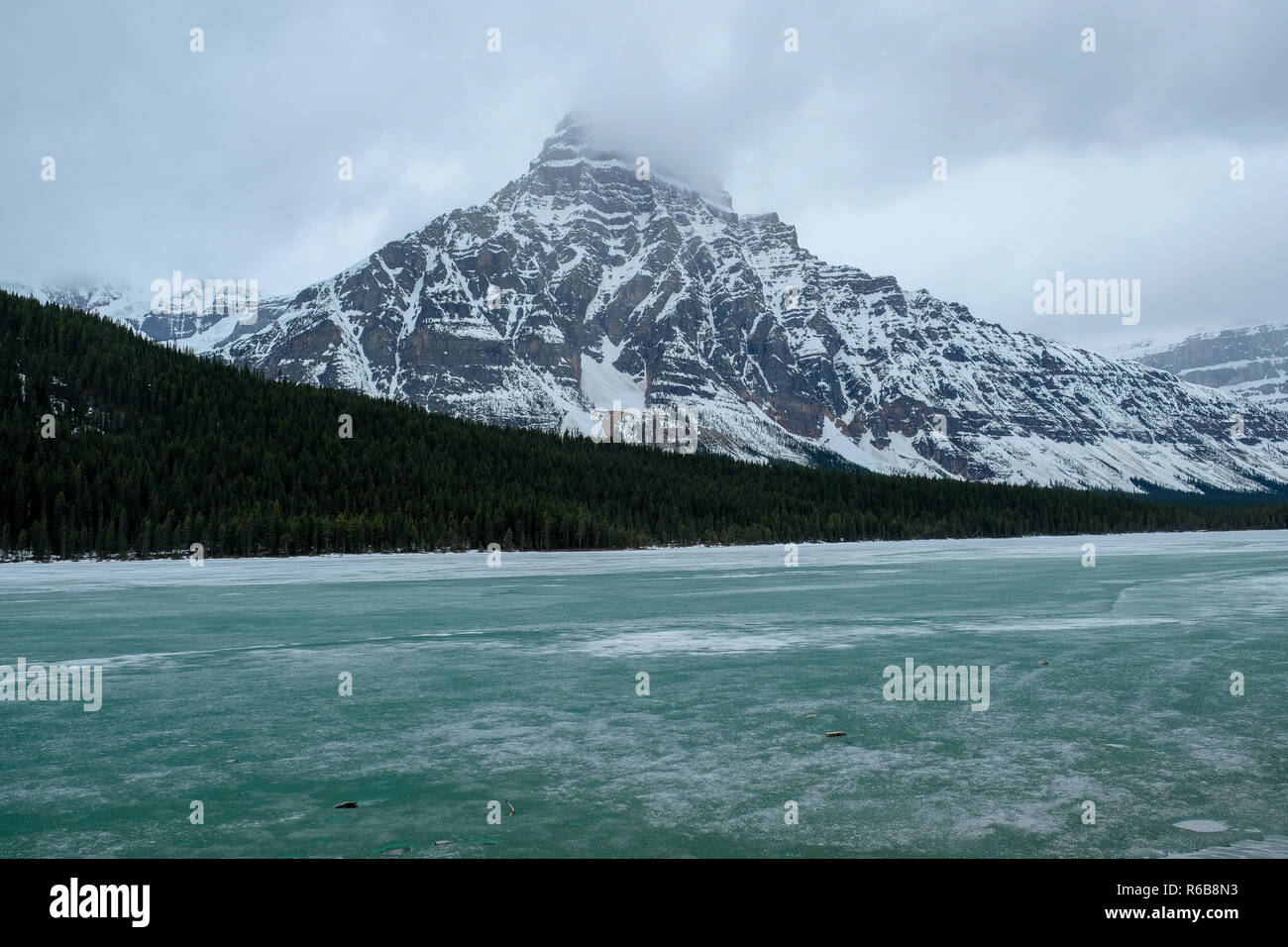 Frozen lake with snow mountain in the background Banff National Park ...