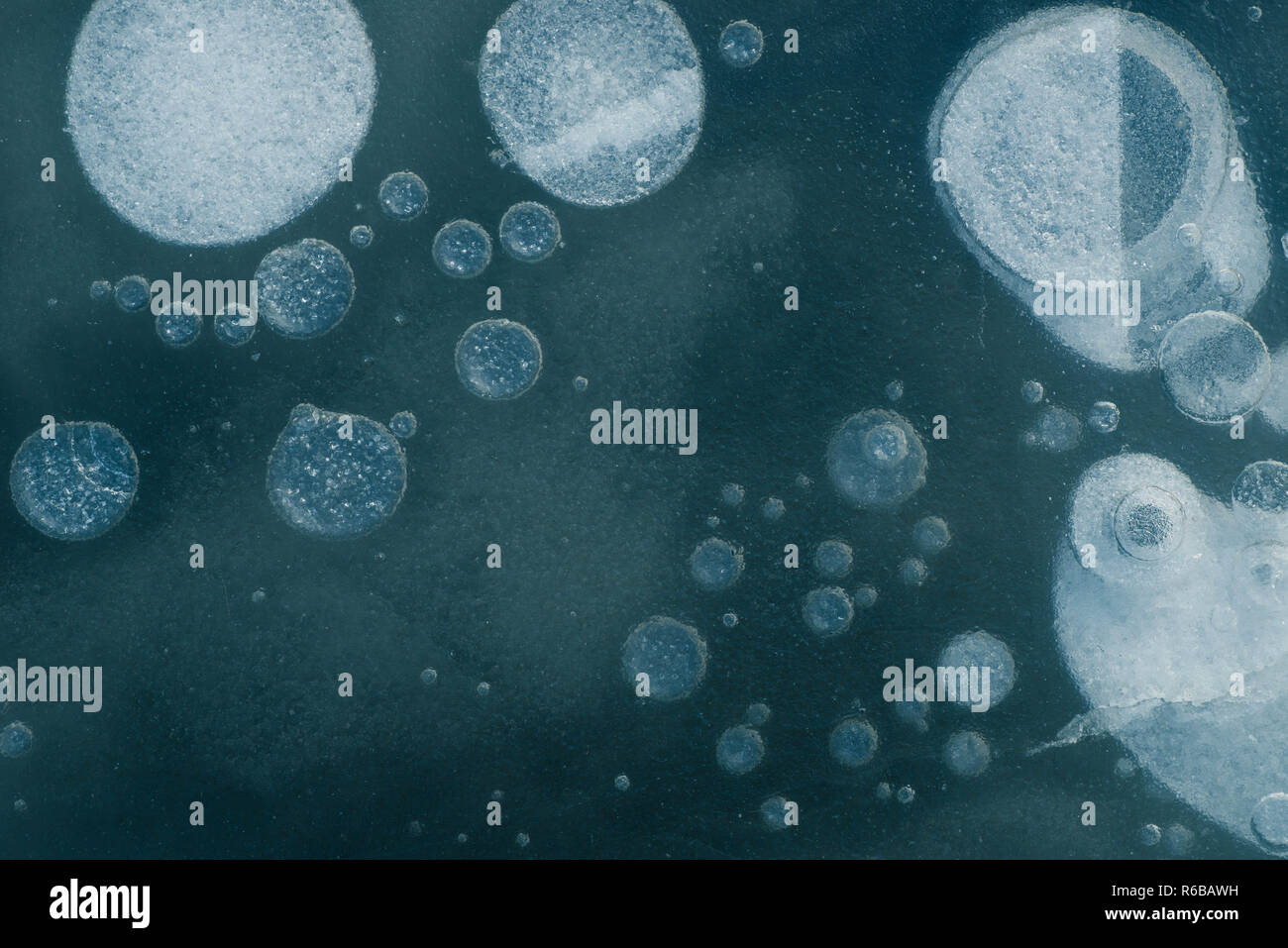 blue color ice on pond winter background texture Stock Photo - Alamy