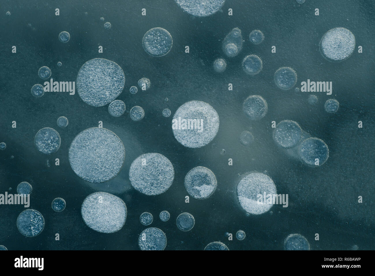 blue color ice on pond winter background texture Stock Photo - Alamy