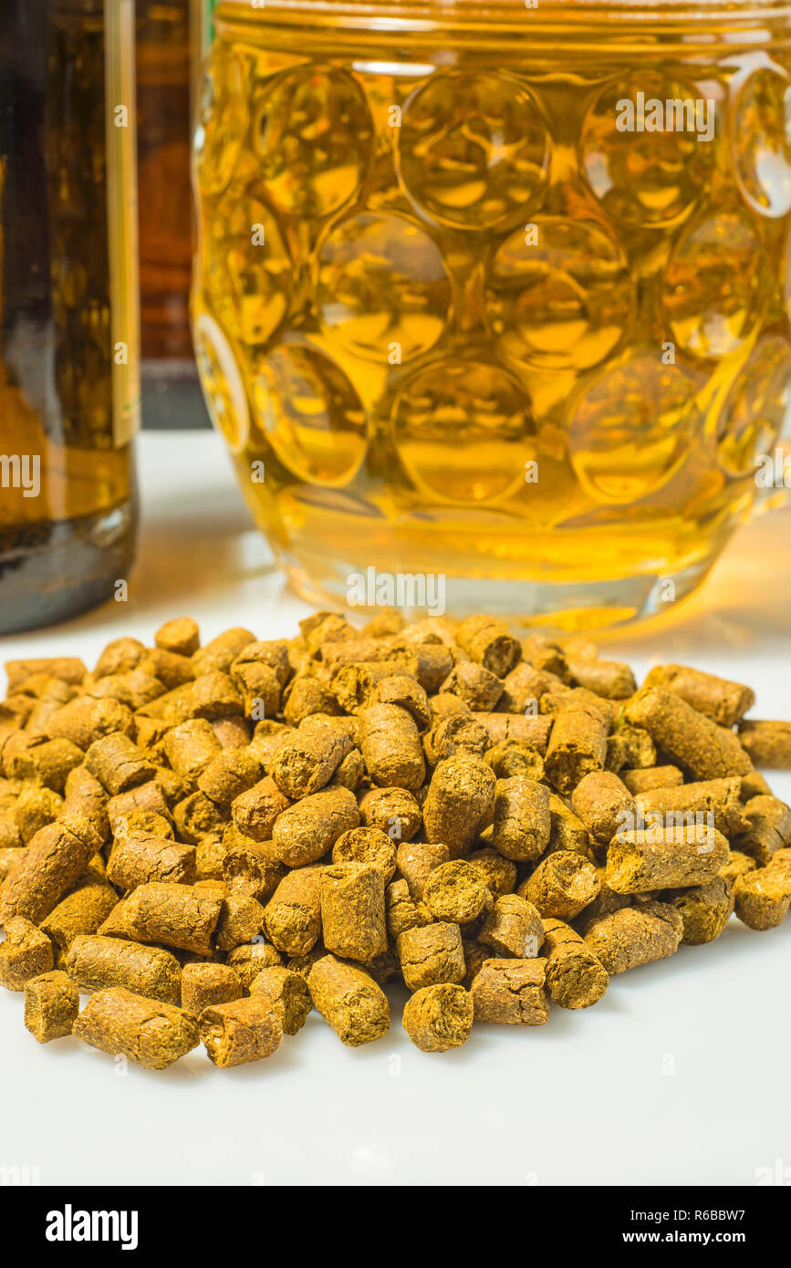Hops Pellets With Beer Glass Stock Photo - Alamy