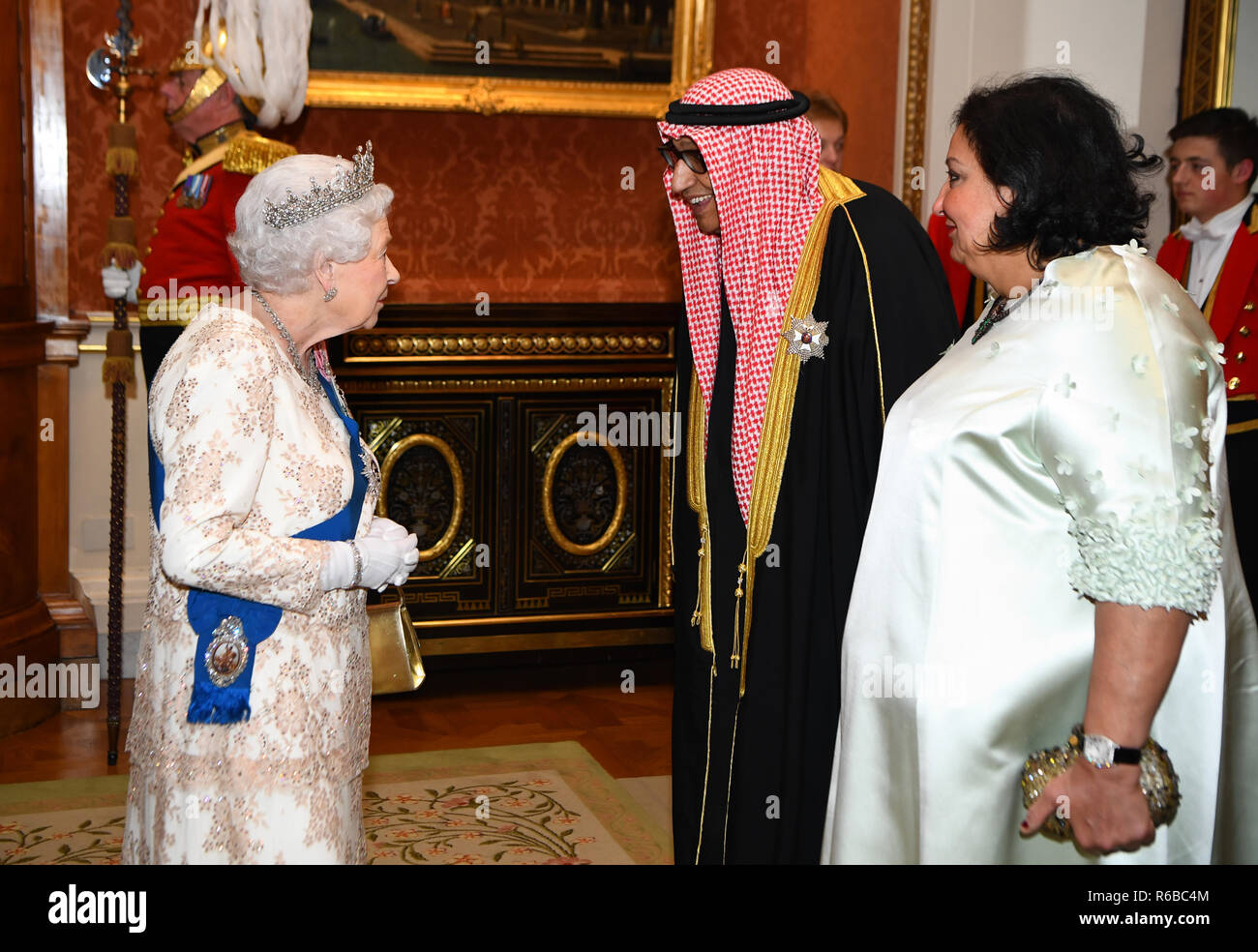 Queen Elizabeth II greets the ambassador of Kuwait at an evening ...