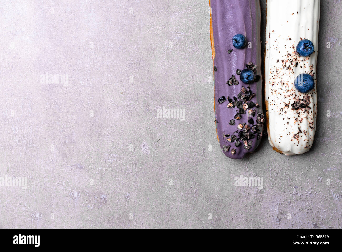 french purple and white fresh eclair background with copy space Stock ...