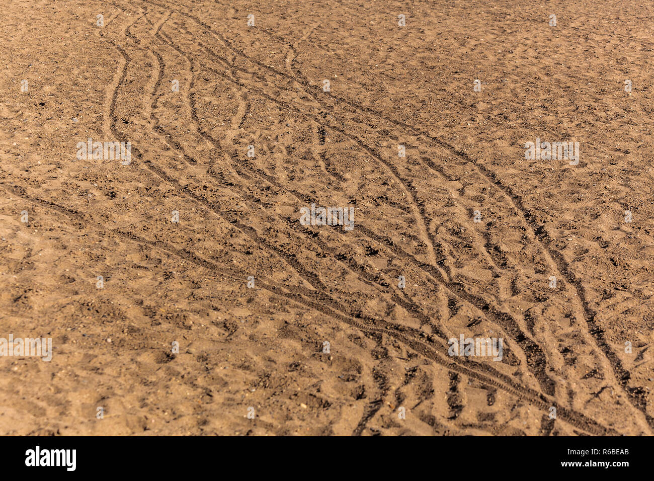Wheel tracks on the sand Stock Photo - Alamy