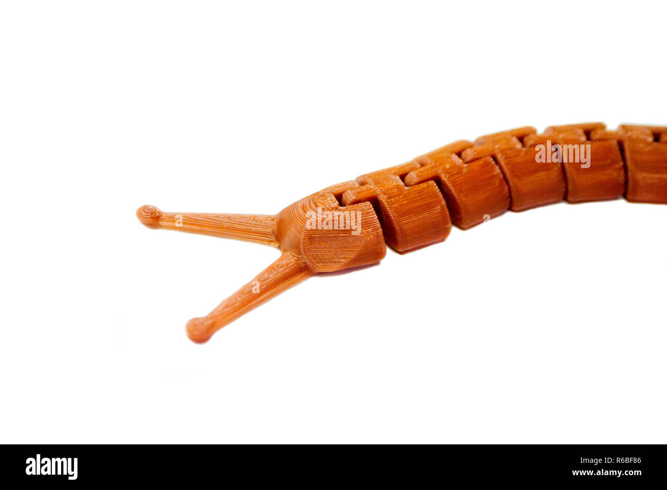 Bright light brown object in shape of caterpillar toy printed on 3d ...