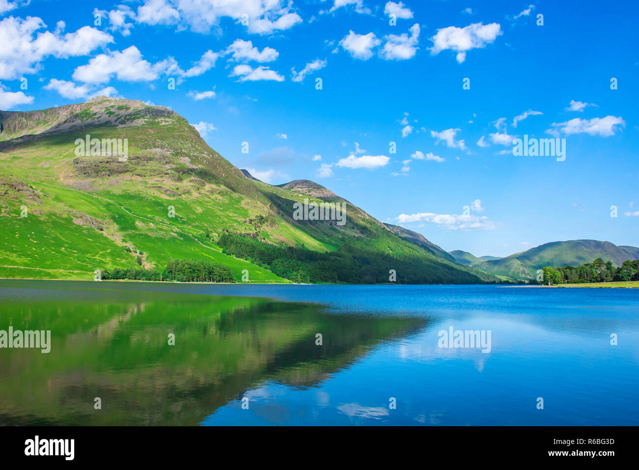 Idyllic landscape of rural Britain.Mountain reflection in lake, green ...