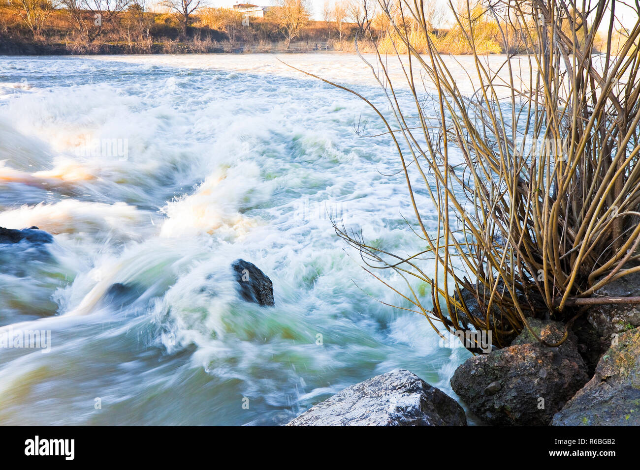 River in flood after several days of rain with copy space Stock Photo ...