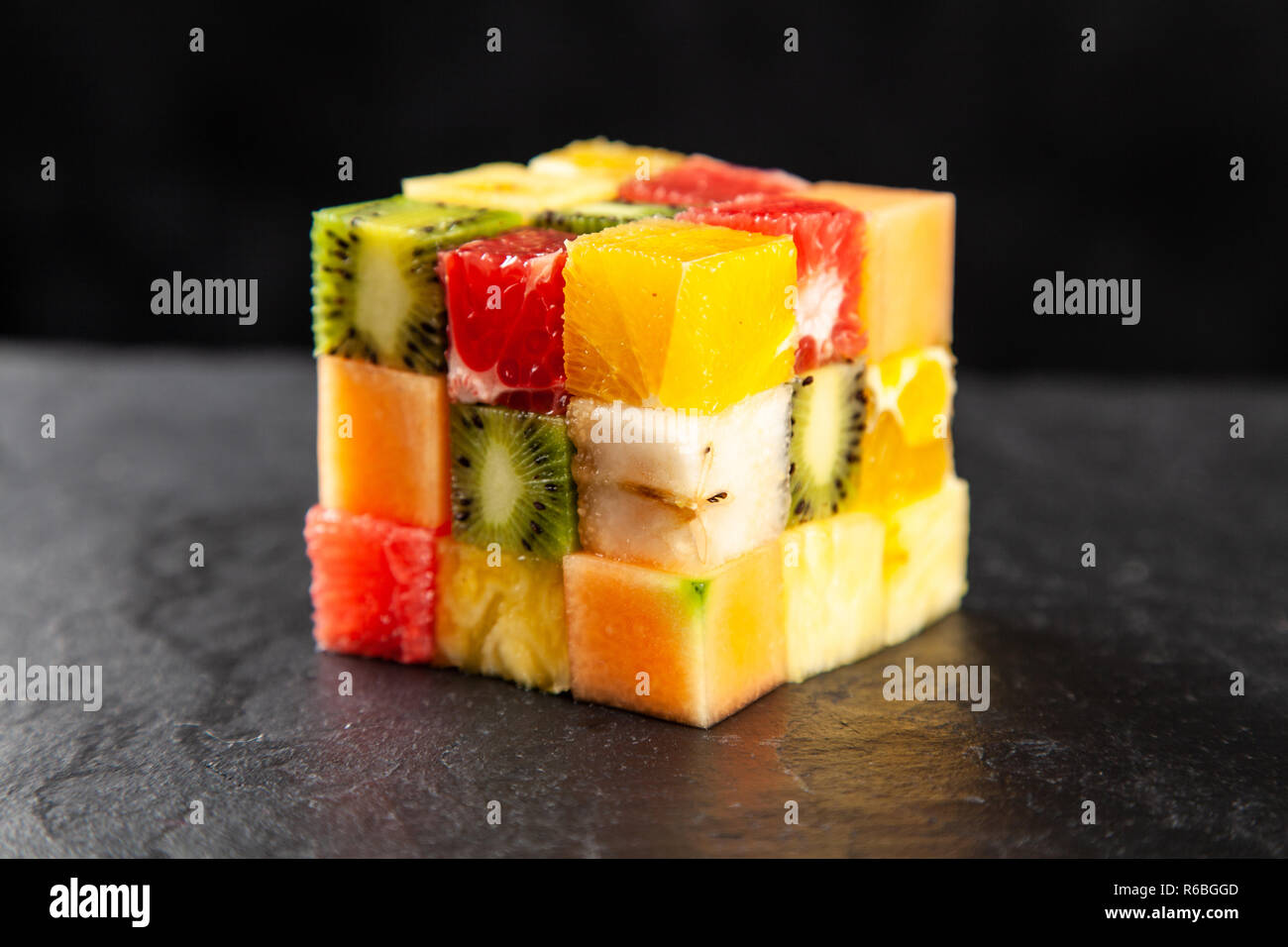 Fruit cube isolated on white background Stock Photo - Alamy