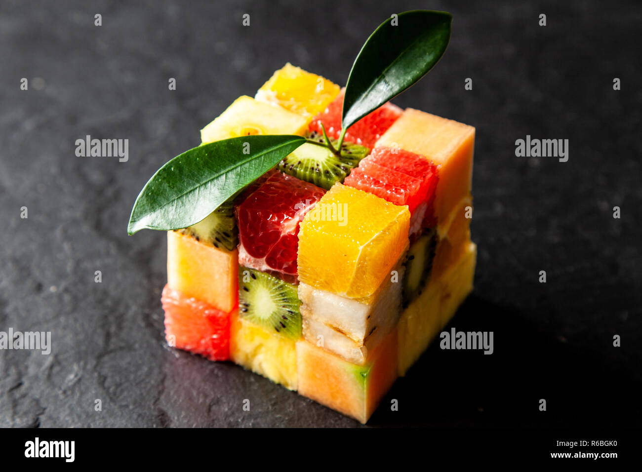 Fruit cube isolated on white background Stock Photo - Alamy