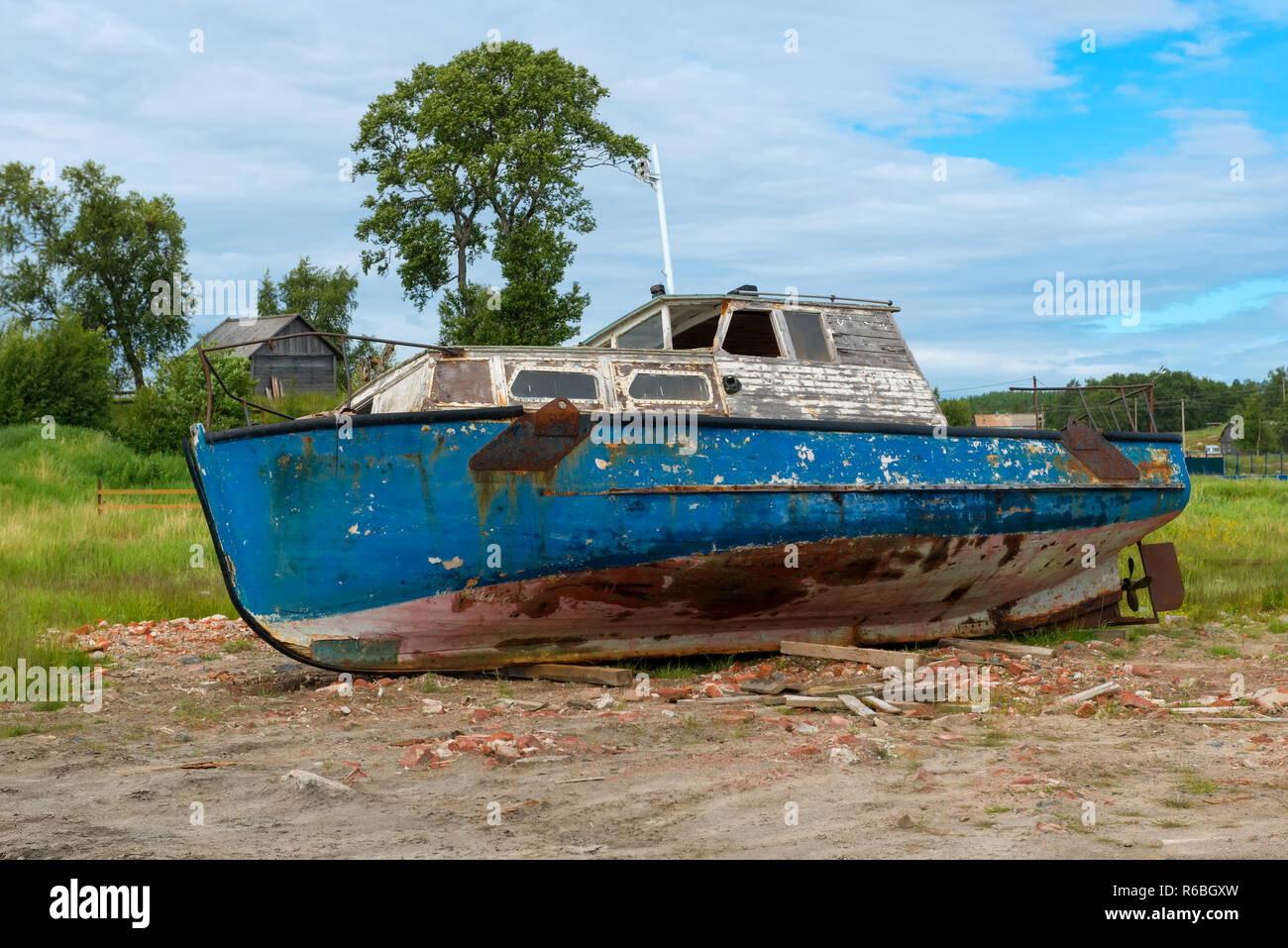 Old broken ship lies on the shore Stock Photo - Alamy