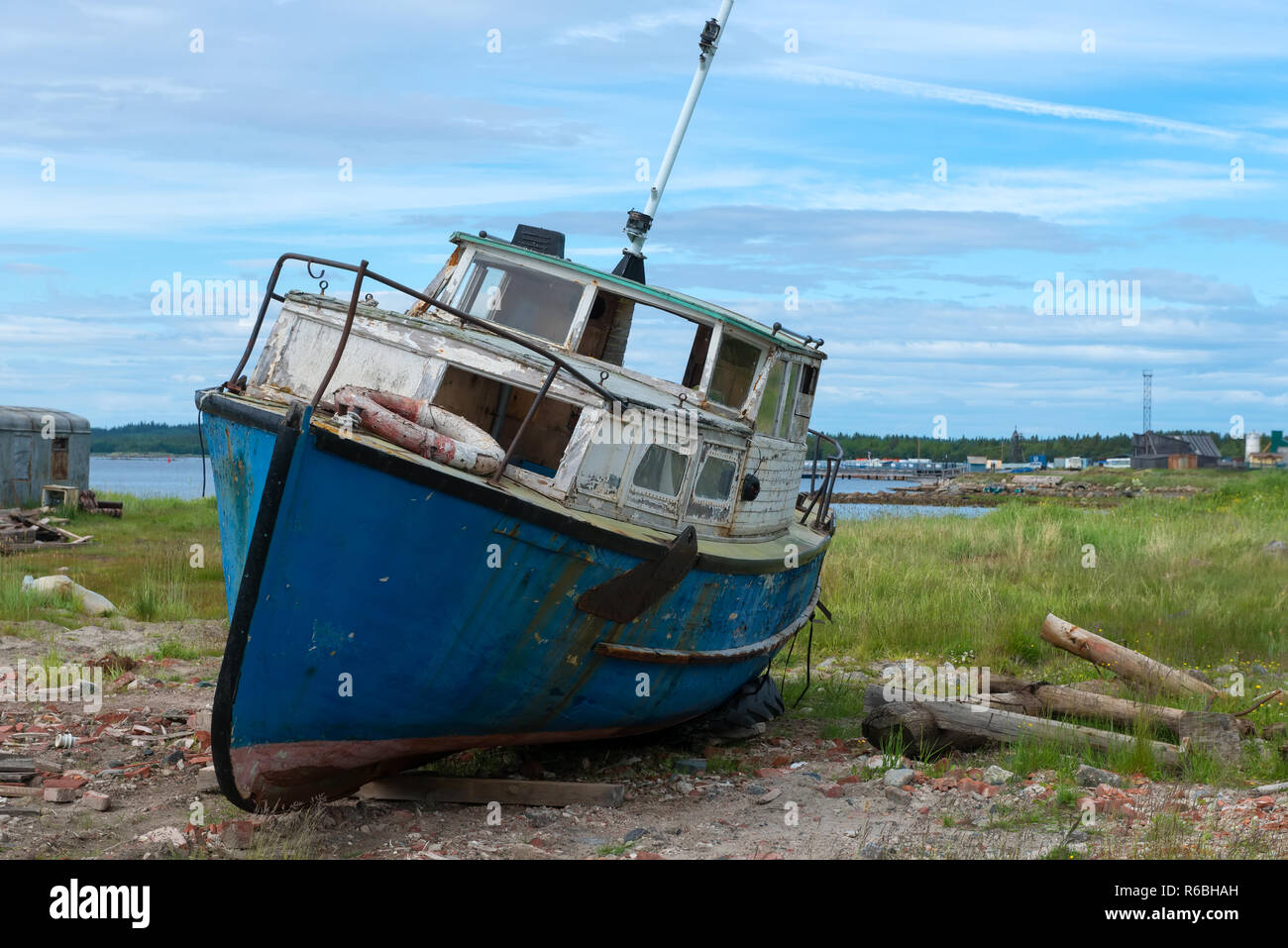 Old broken ship lies on the shore Stock Photo - Alamy