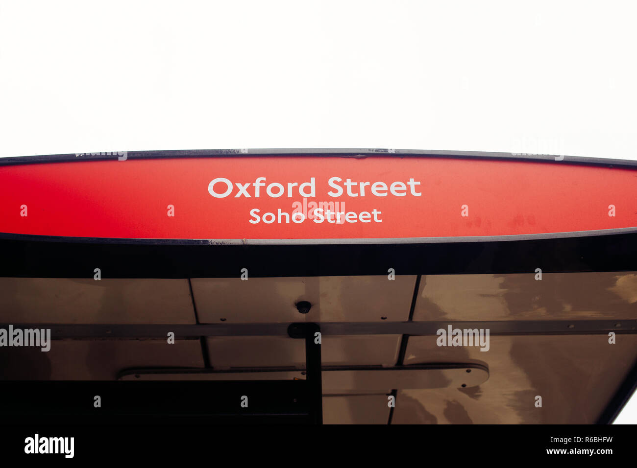 Oxford street bus stop in the center of London, UK. A bus stop is a ...
