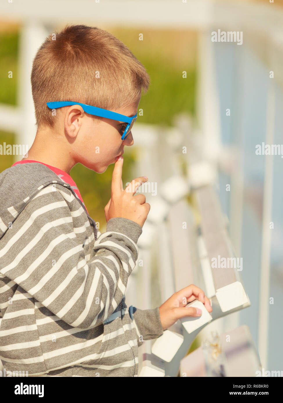 Leisure and free time concept. Portrait of little boy spending time ...