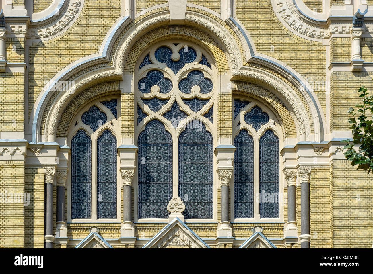 Large arched window of the synagogue with stained glass Windows on the ...