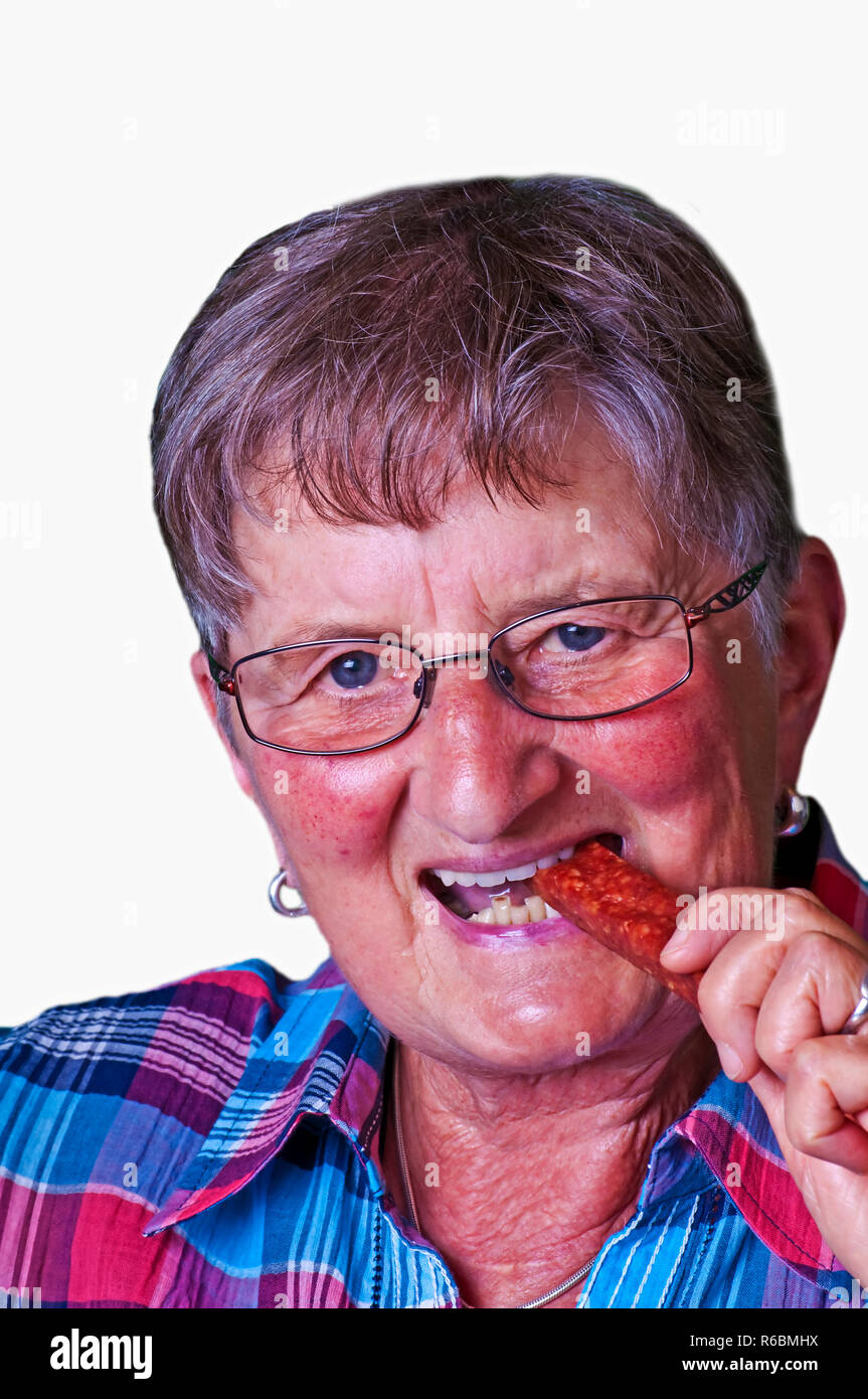 Grandma Enjoys Smoked Sausage Stock Photo - Alamy