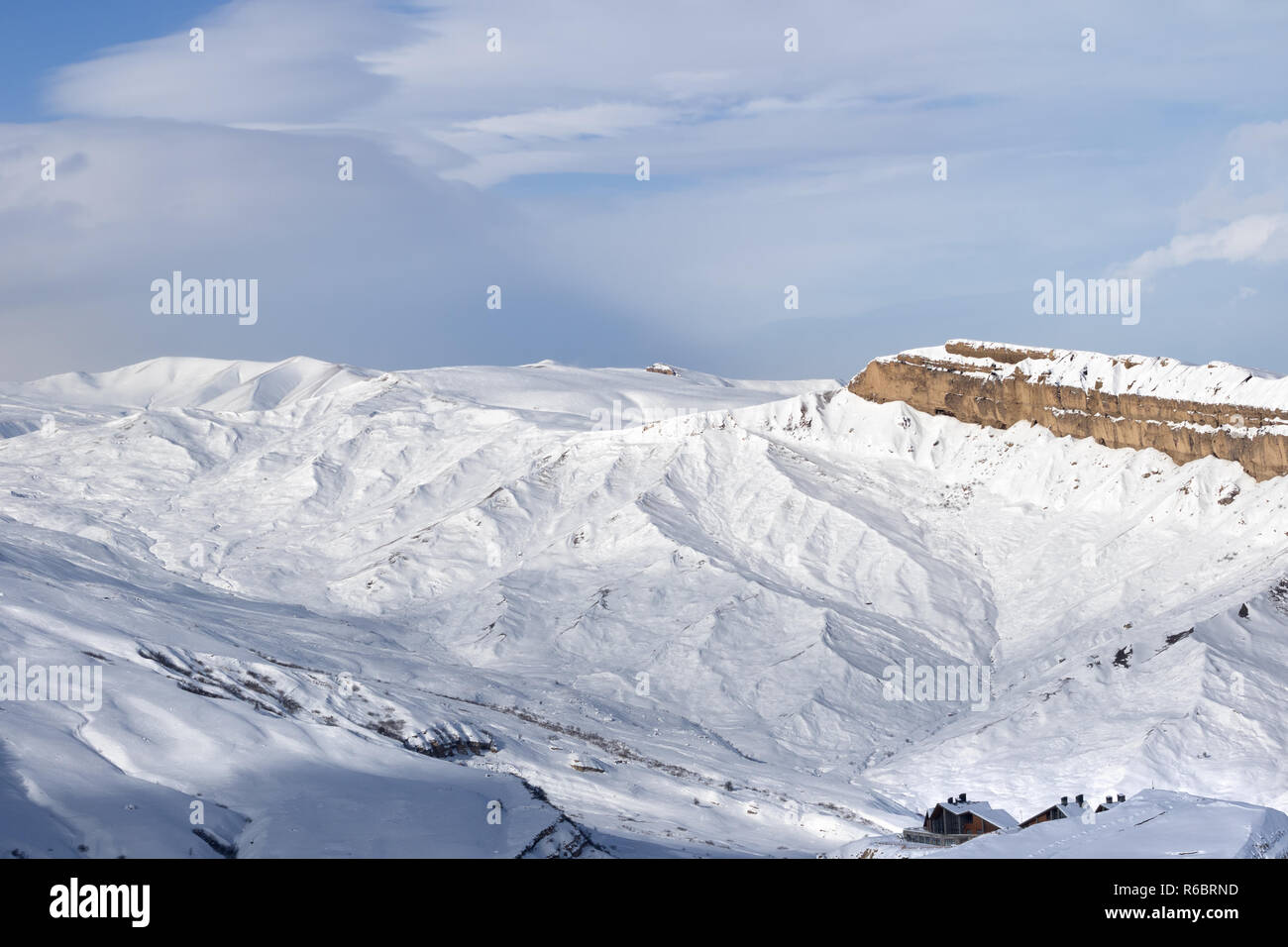 Snowy winter mountains and beautiful sky with clouds at nice sun day ...