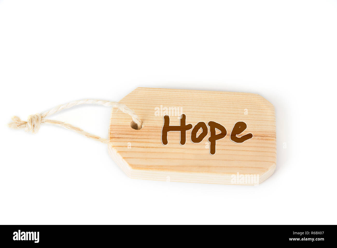 Wooden tag on a white background. Hope concept Stock Photo - Alamy