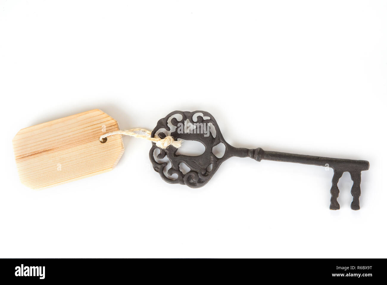 Old vintage key with a wooden tag on a white. Concept for hope and ...