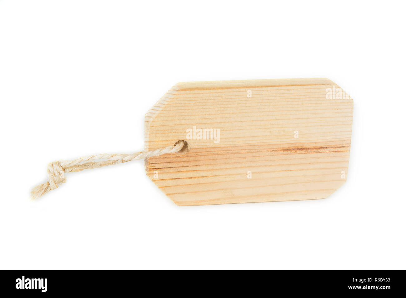 Wooden tag with a string on a white background Stock Photo - Alamy