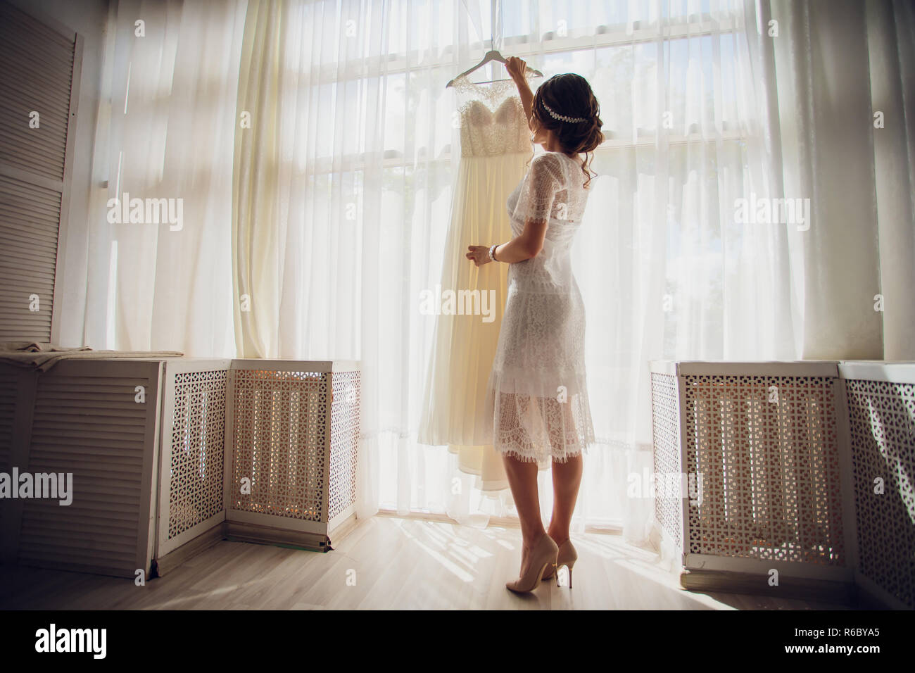 Woman in silk dressing gown hi-res stock photography and images - Alamy