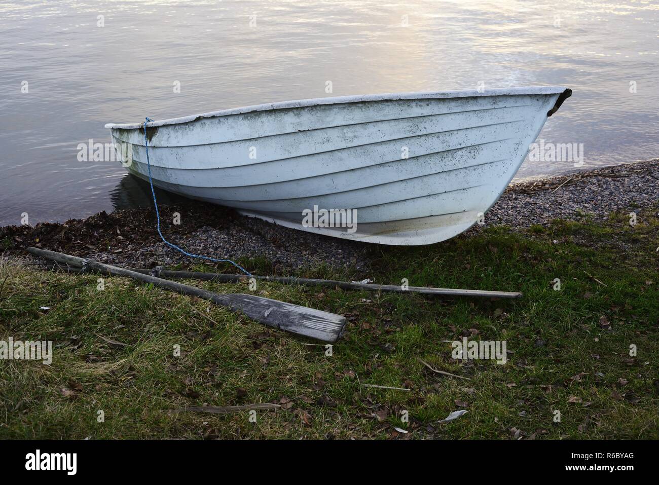 wooden boat and oars on the lake Stock Photo - Alamy