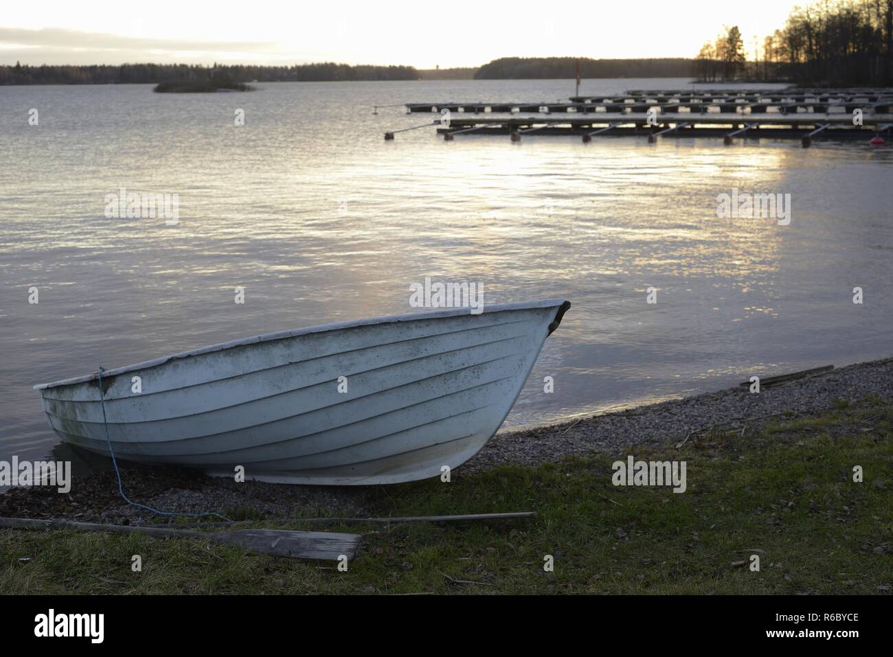 wooden boat and oars on the lake Stock Photo - Alamy