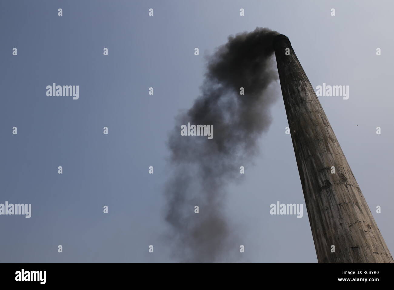 Burning brick in the brick yards in Dhaka, Bangladesh. Labors including ...