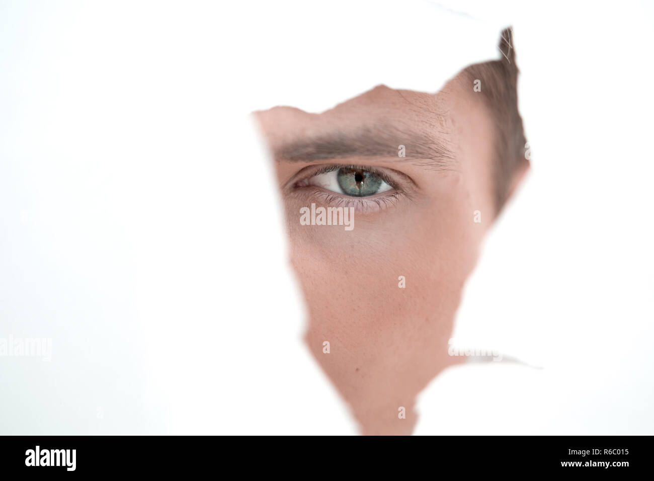 Man Looking Through Hole In Wall High Resolution Stock Photography and ...