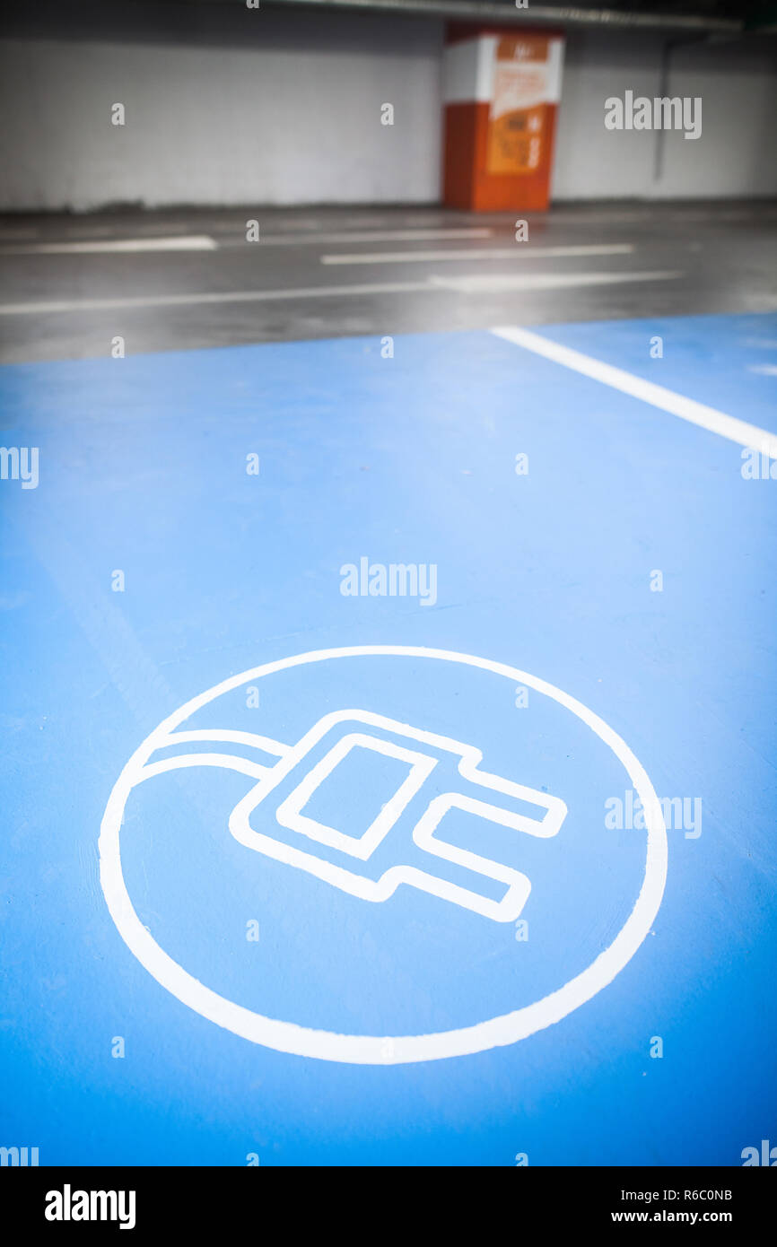 Electric car charging place Stock Photo - Alamy
