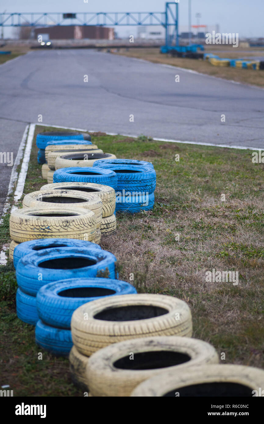 Yellow and blue tires on a race track Stock Photo - Alamy