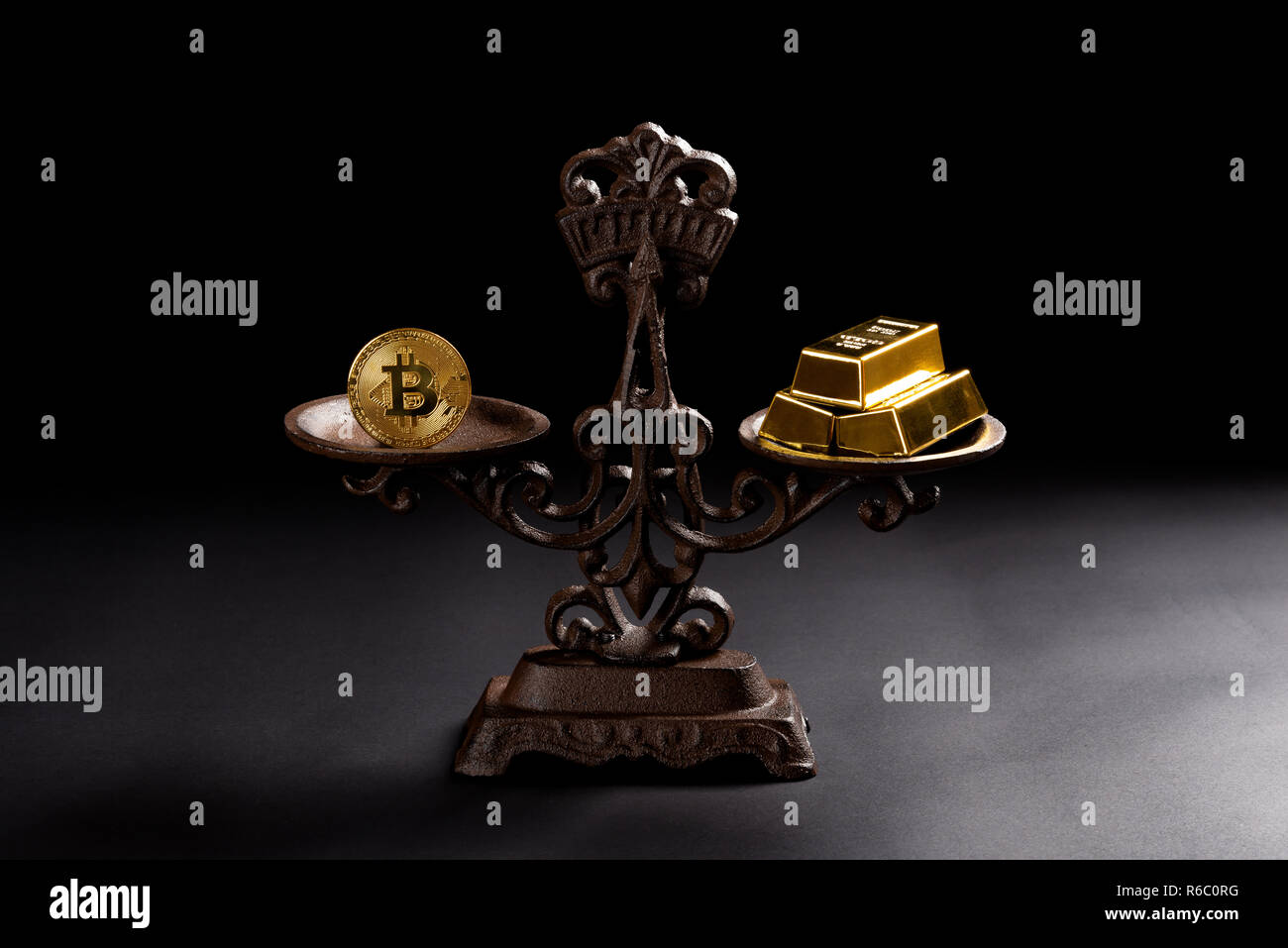 bitcoin and gold bars on a balanced scale concept of the value of ...