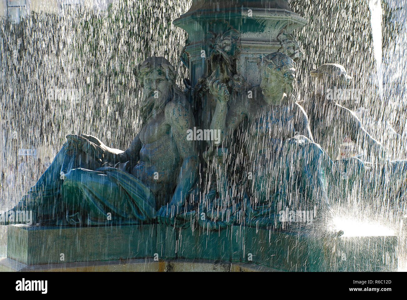Baroque style bronze fountain on Rossio square in Lisbon, Portugal ...