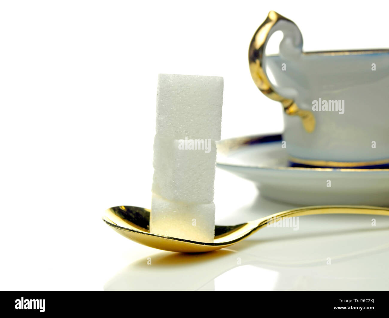 Lump Sugar With Spoon And Cup Stock Photo - Alamy