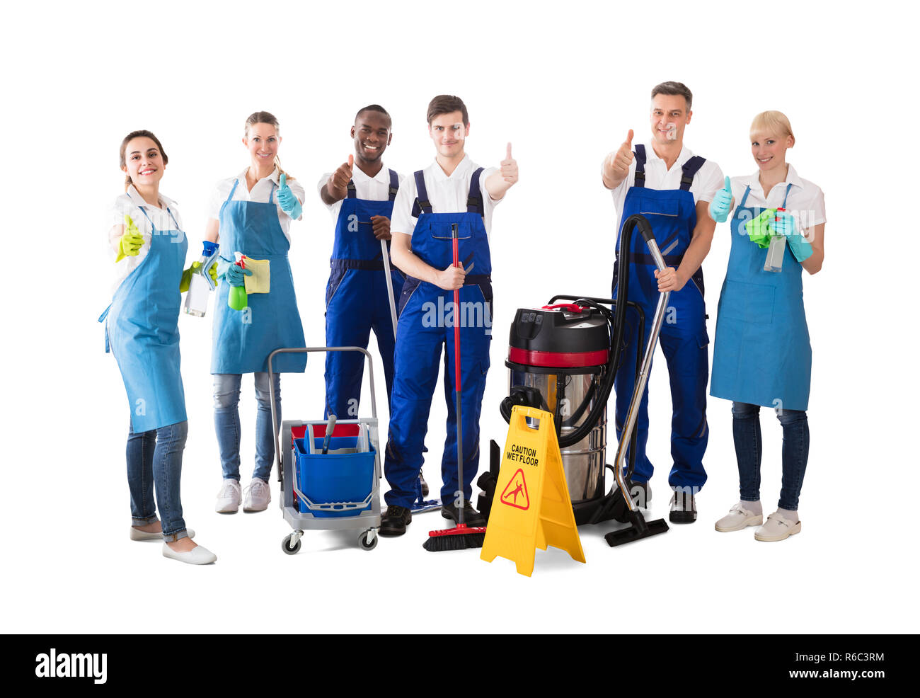 Group Of Janitors Gesturing Thumbs Up Stock Photo - Alamy
