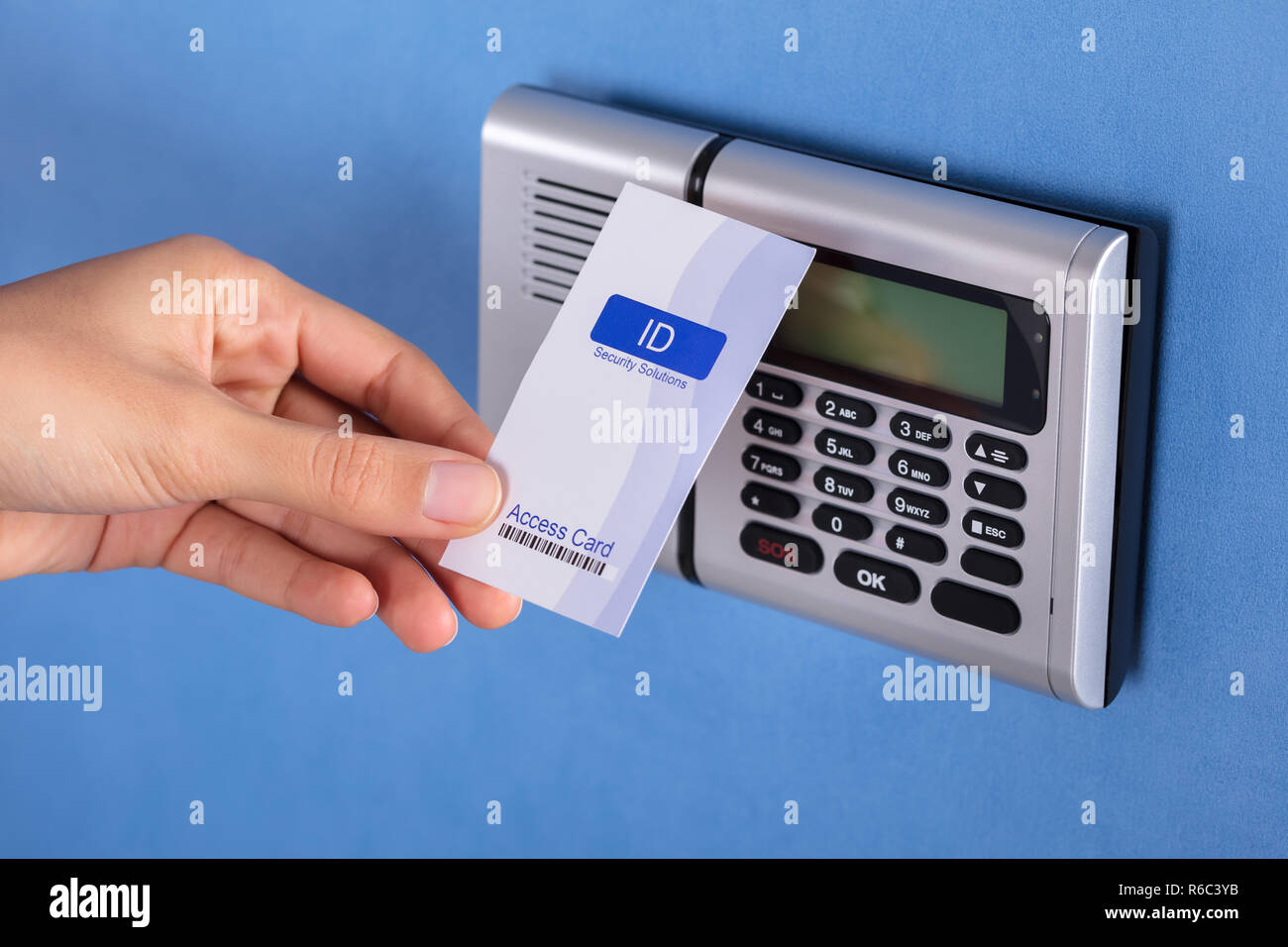 Person Holding Key Card Near Security System Stock Photo - Alamy