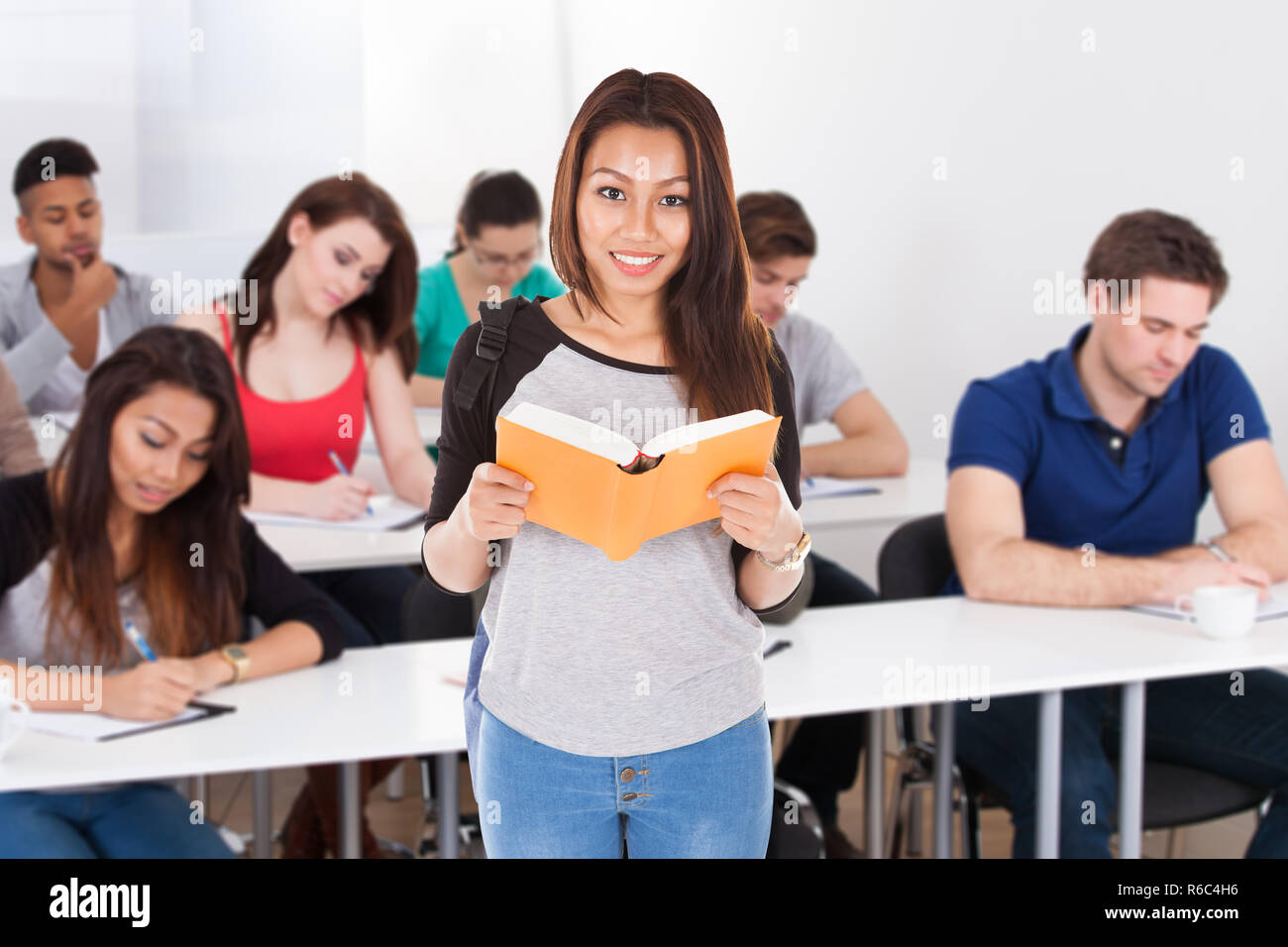 Female Student Reading Book Stock Photo - Alamy