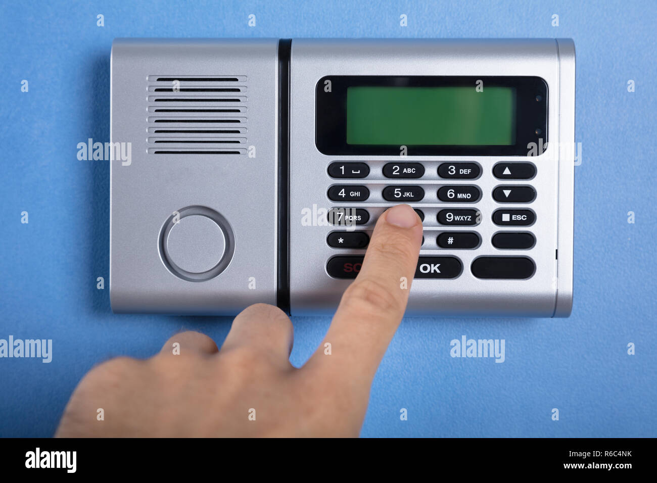 Person's Finger Entering Code In Security System Stock Photo - Alamy