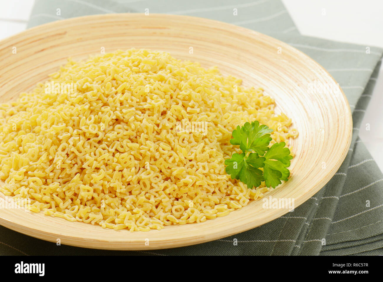 uncooked alphabet pasta Stock Photo - Alamy