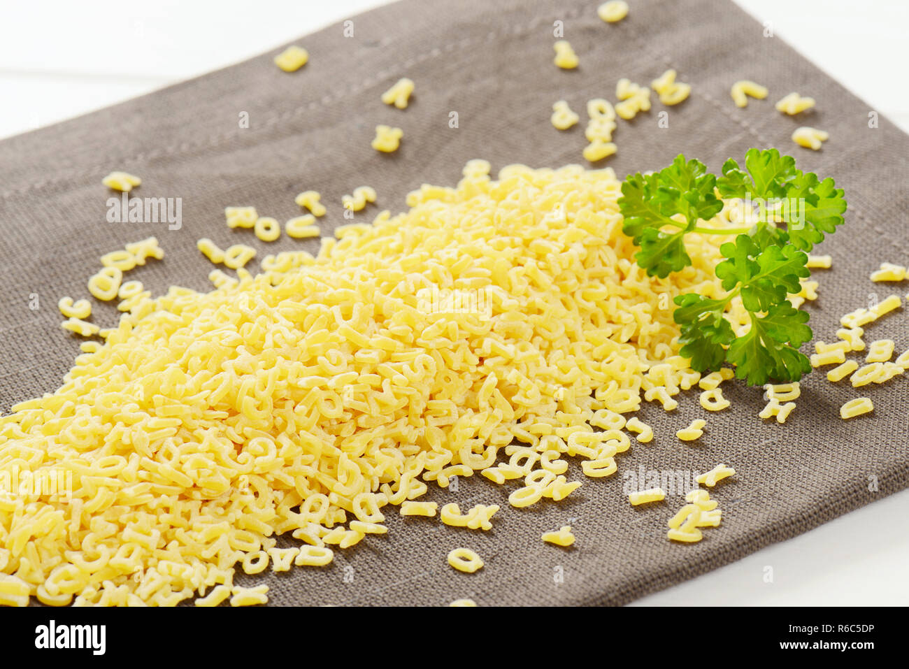 uncooked alphabet pasta Stock Photo - Alamy