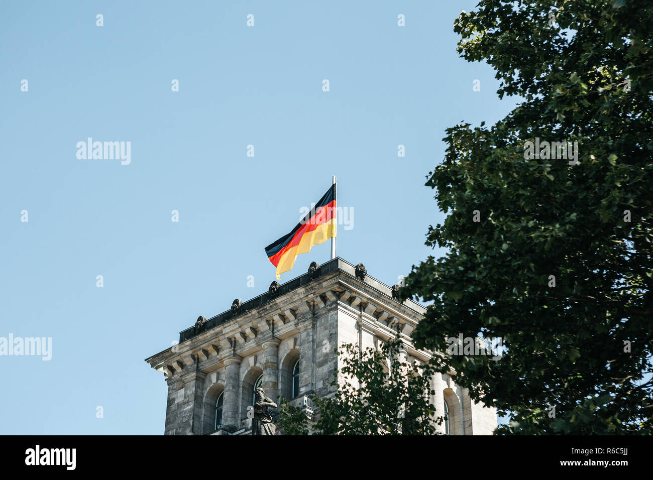 German flag over the Reichstag building in Berlin in Germany Stock ...