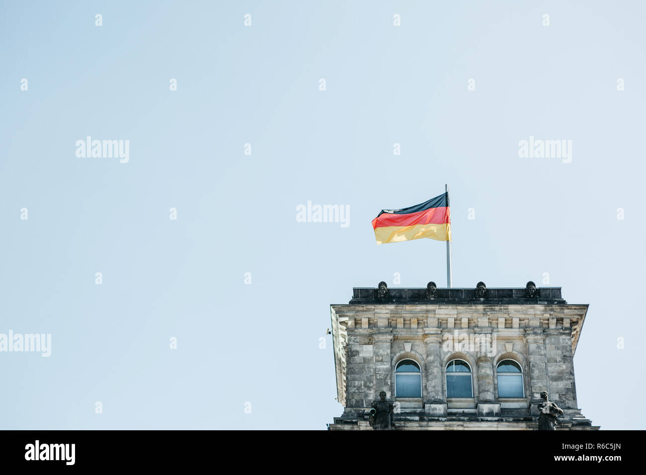 German flag over the Reichstag building in Berlin in Germany Stock ...