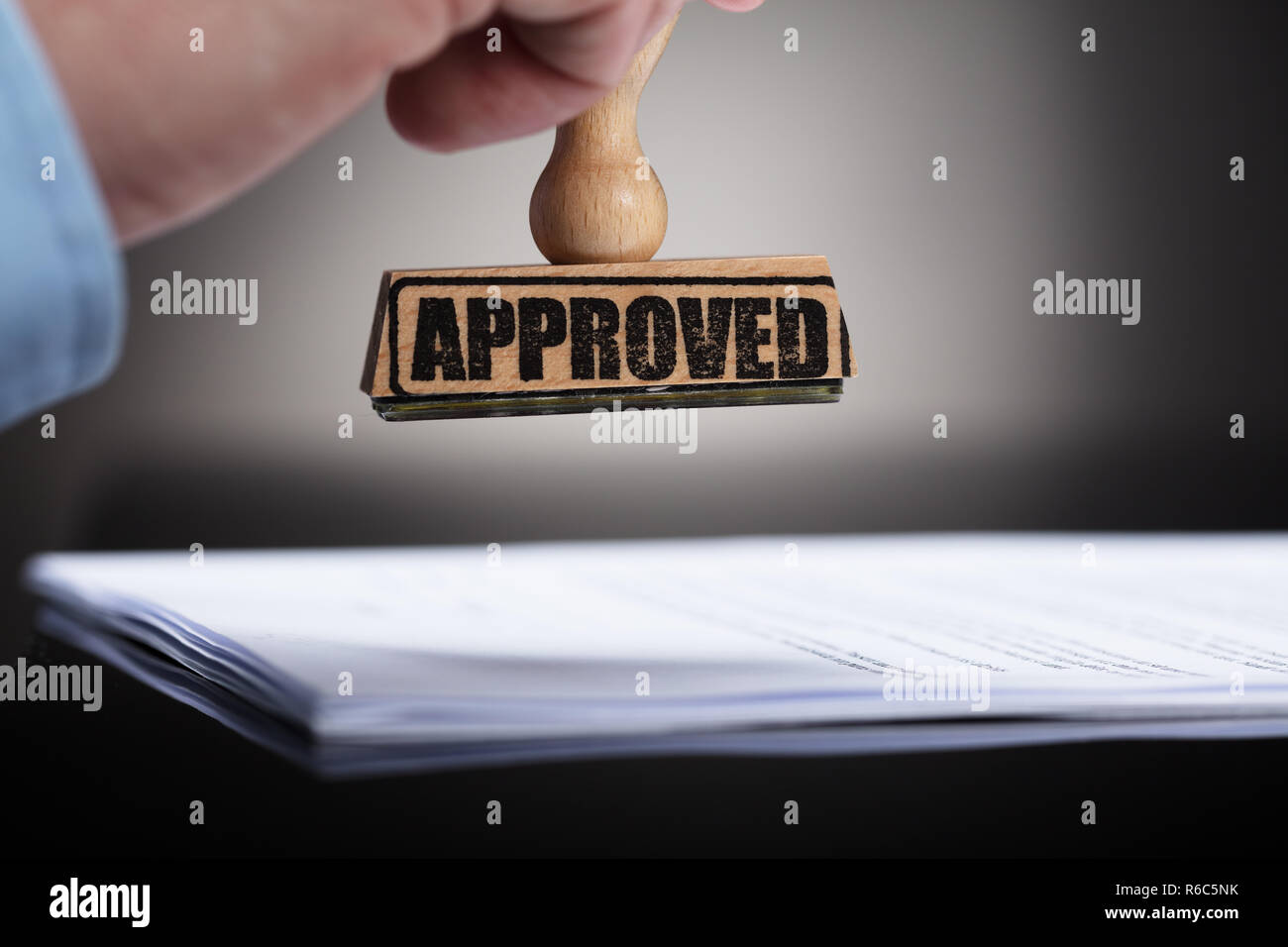 Businessperson Stamping On Approved Contract Form Stock Photo - Alamy