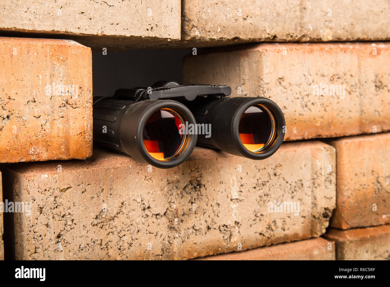 Spy glass sticking out of a wall, an immigration concept Stock Photo ...