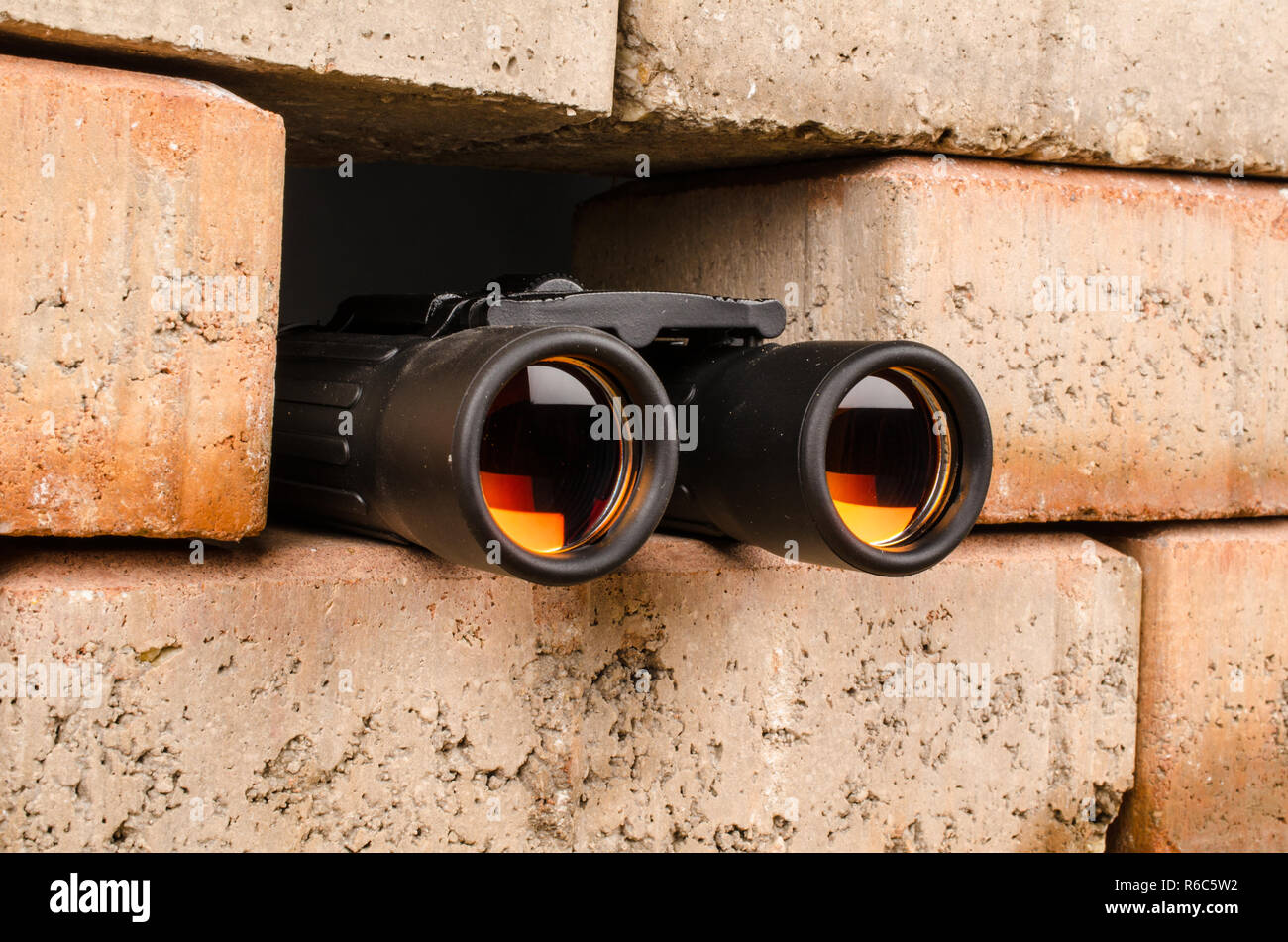 Spy glass sticking out of a wall, an immigration concept Stock Photo ...
