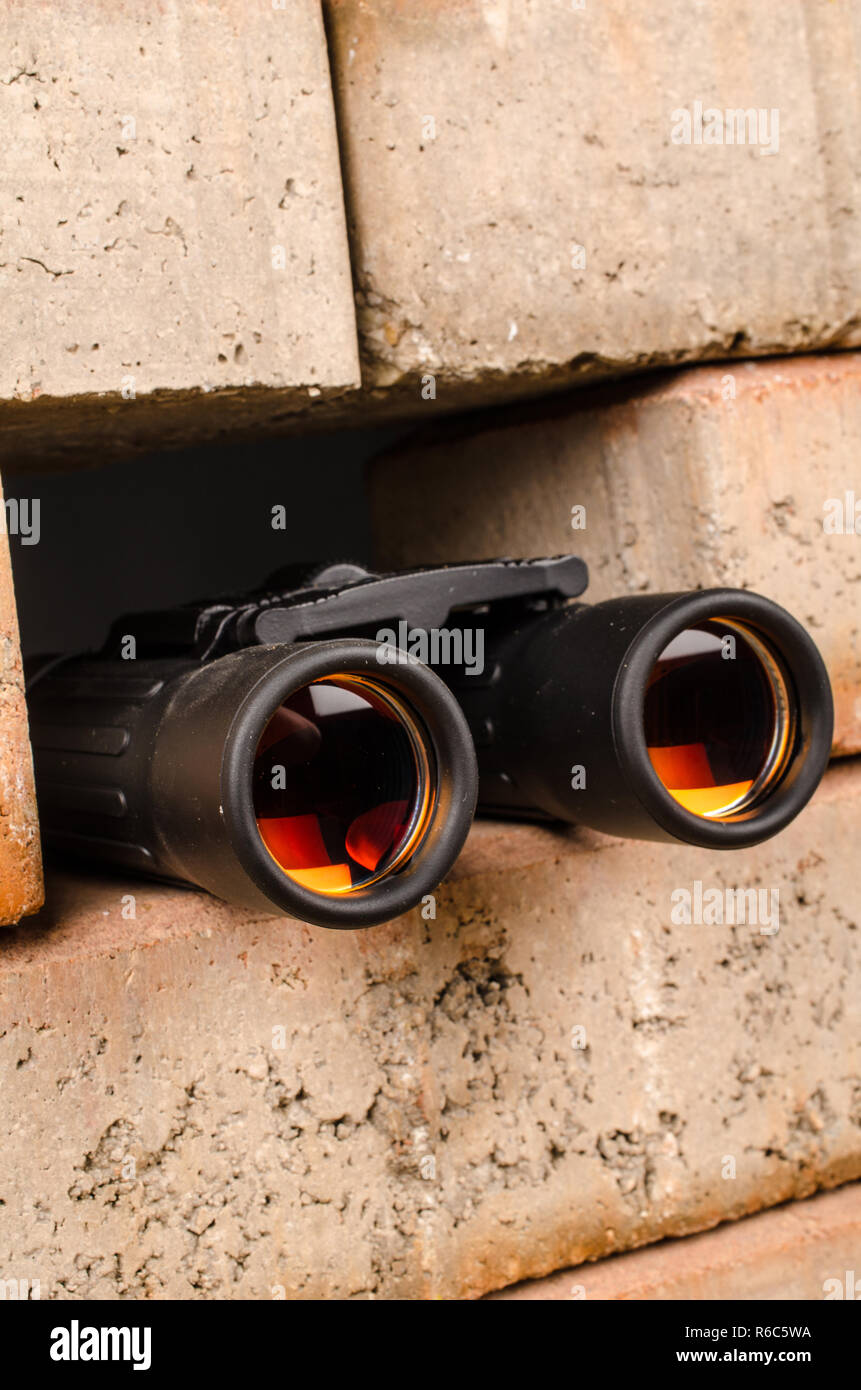 Spy glass sticking out of a wall, an immigration concept Stock Photo ...