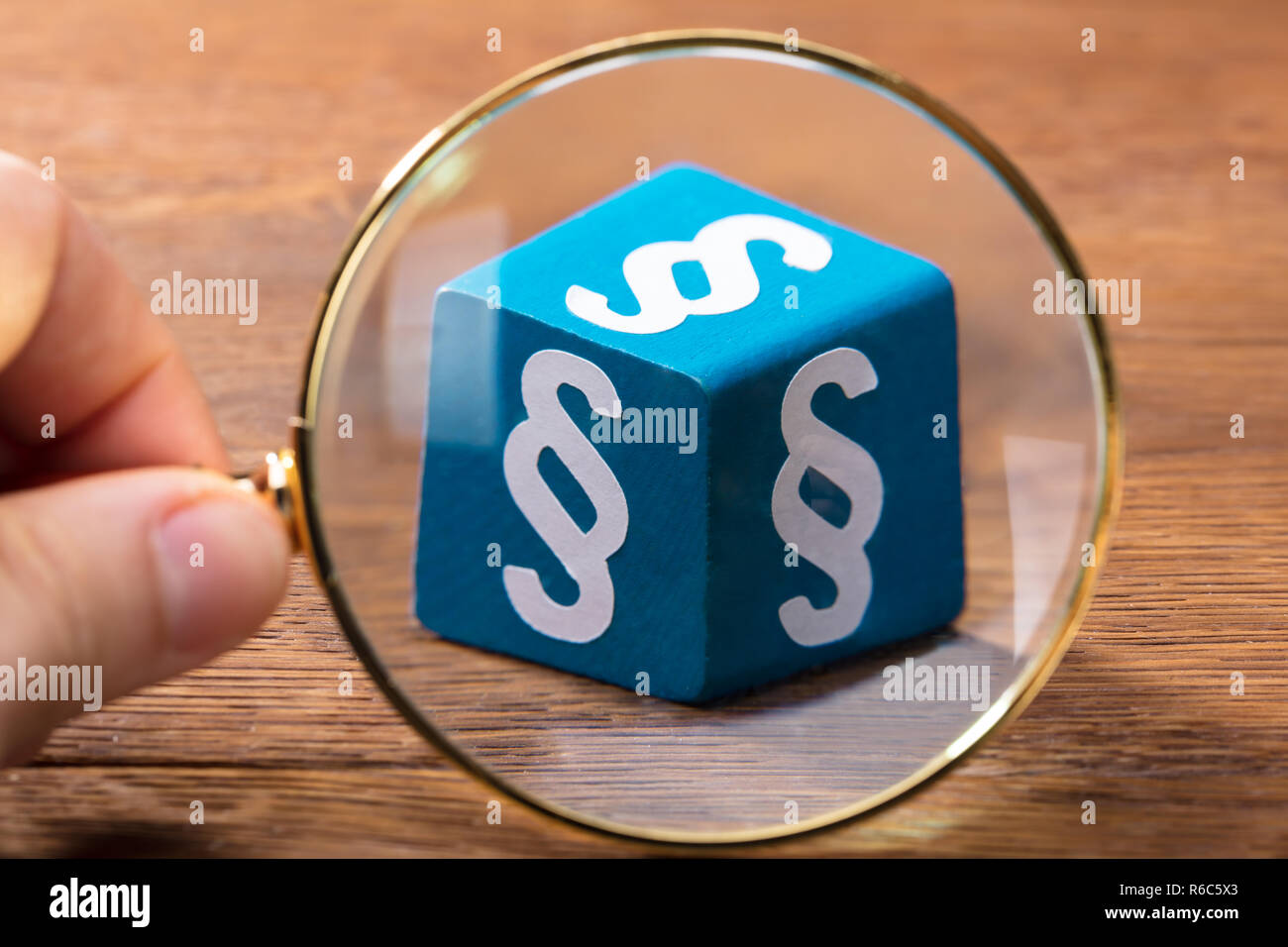 Person Examining The Blue Paragraph Block With Magnifying Glass Stock ...