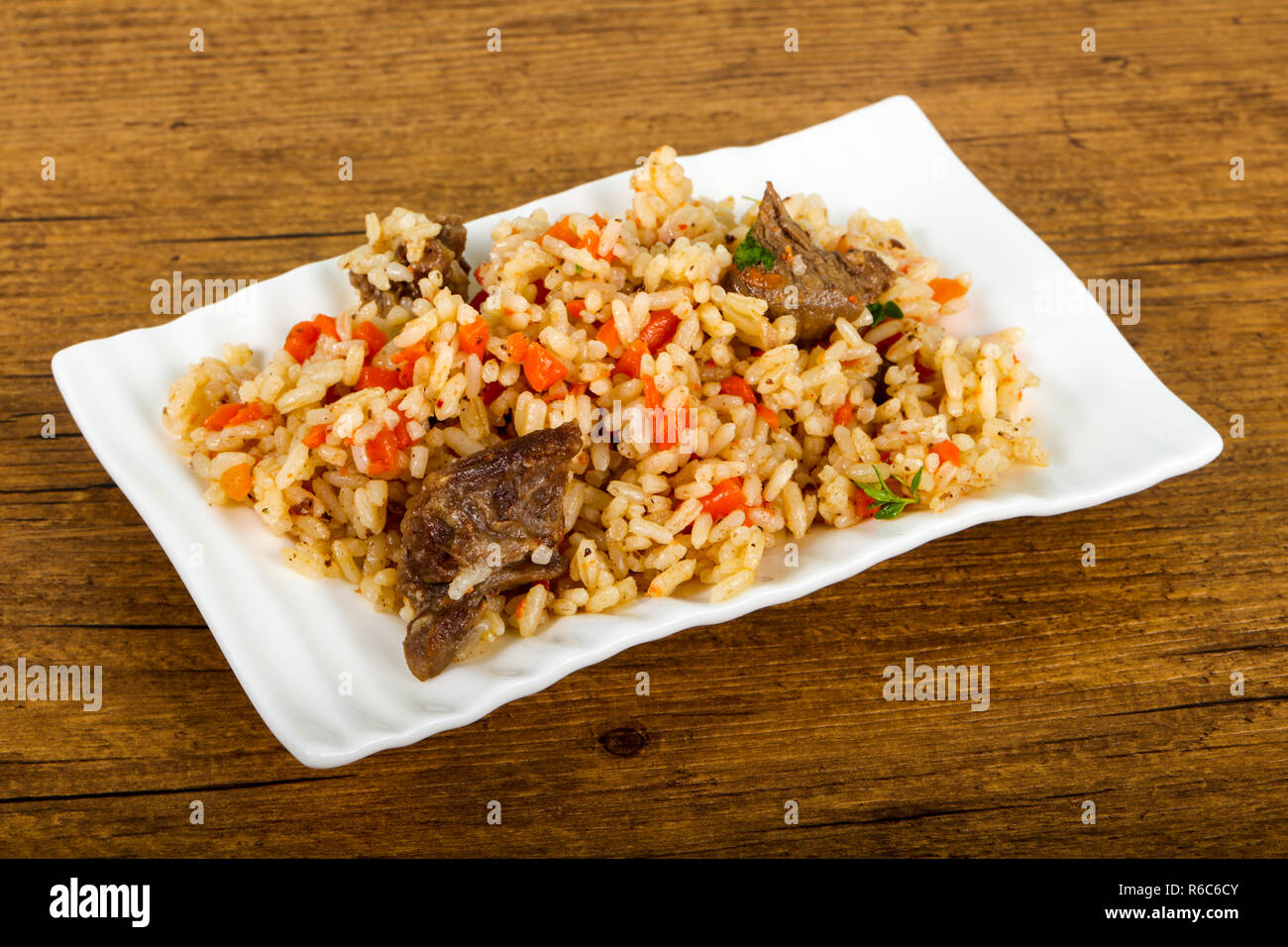 Asian rice - Plov with meat and carrot Stock Photo - Alamy