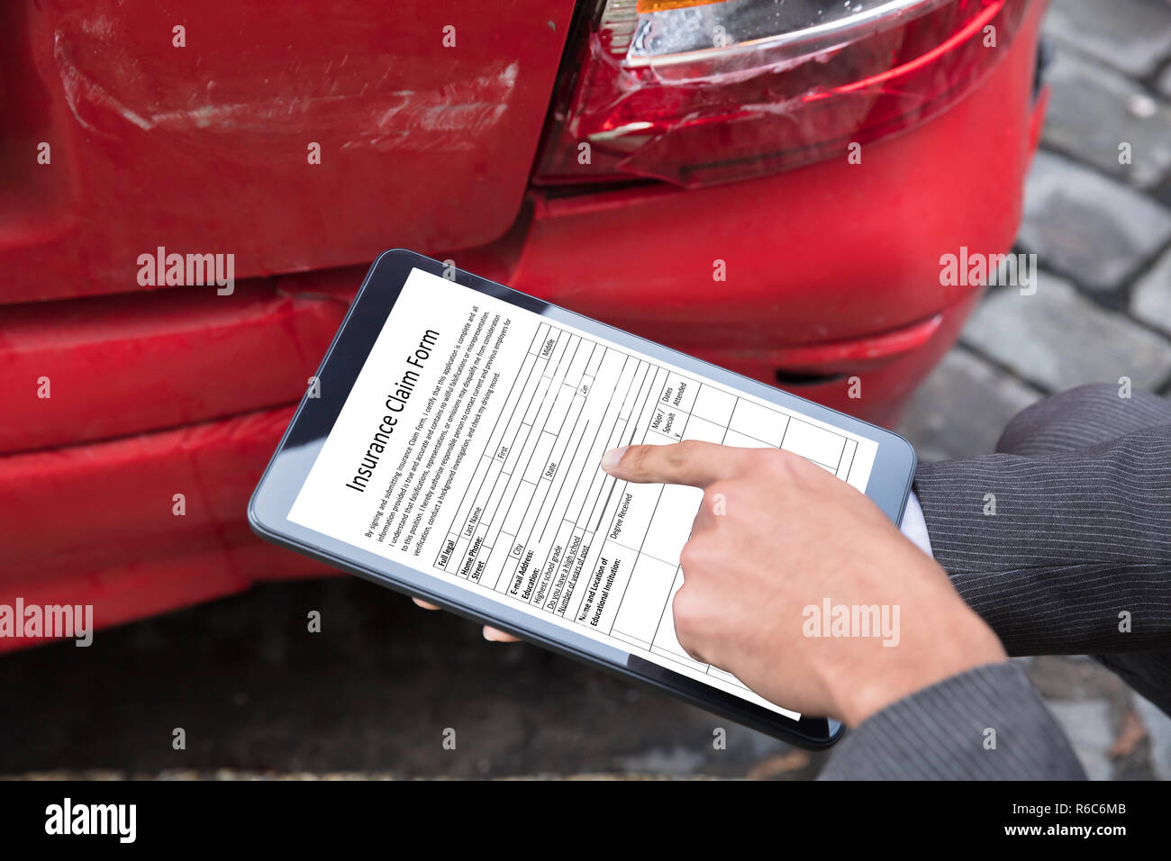 Insurance Agent Filling Insurance Claim Form On Digital Tablet Stock ...