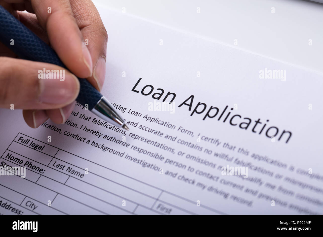 Person Filling Loan Application Form Stock Photo - Alamy